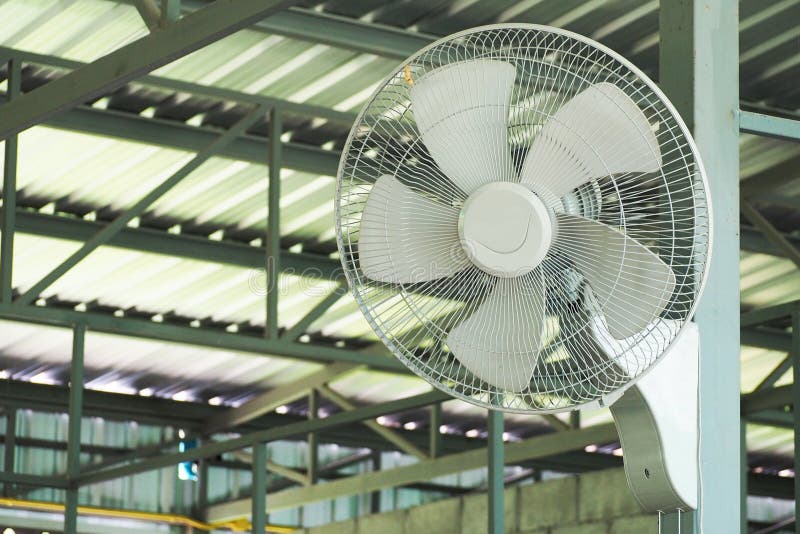 Metal fan hanging on pole stock image. Image of cooling - 74477119
