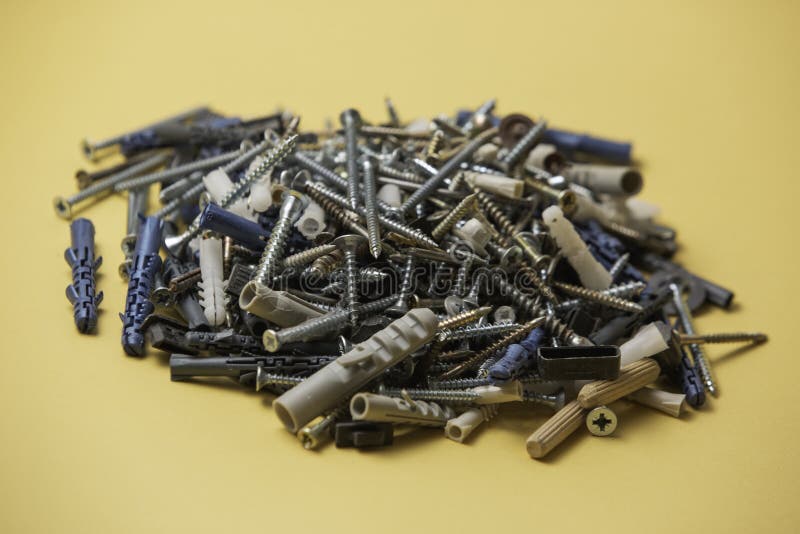 Metal Fasteners on a Yellow Background Stock Image - Image of steel ...
