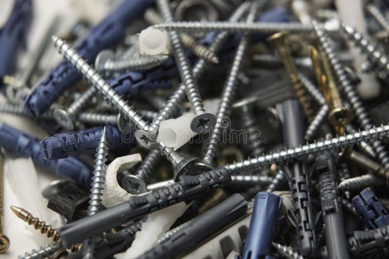 Metal Fasteners on a Yellow Background Stock Image - Image of bolts ...