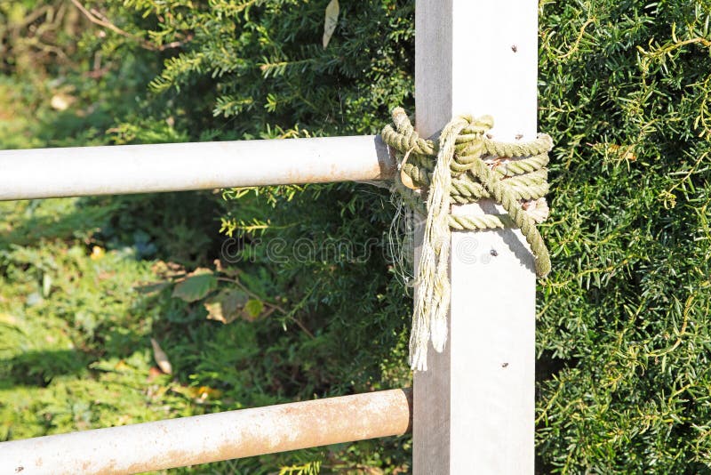 Metal Fence Closed with a Piece of String Stock Image - Image of garden ...