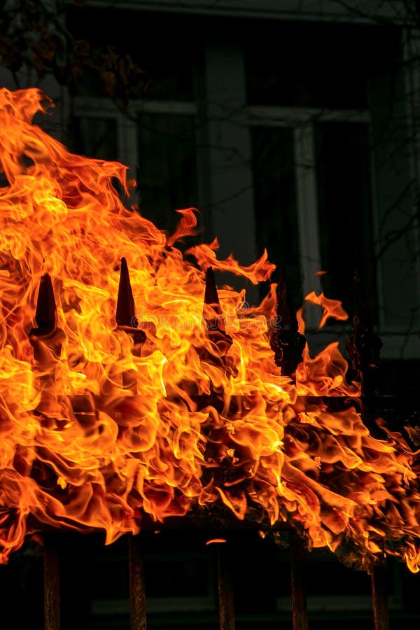 Metal Fence on Fire. the Process of Burning Old Paint on a Metal ...