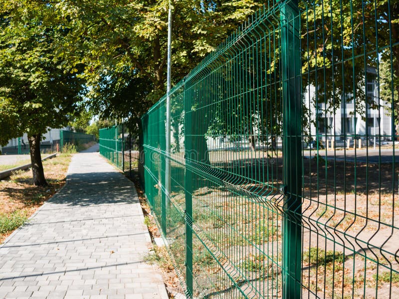 Metal Fence Made of Mesh with Rectangular Cells Stock Image - Image of ...