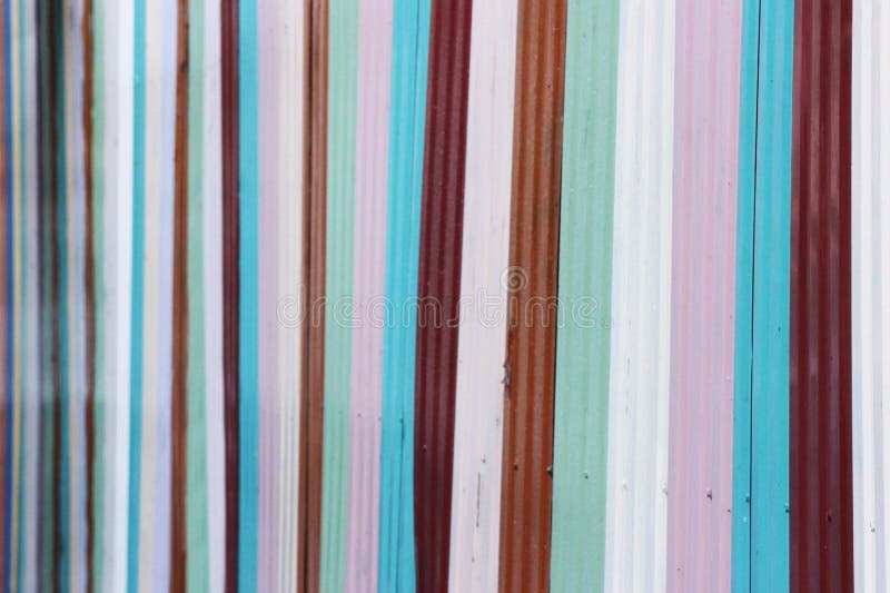 Metal Fence, Painted with Stripes and Paint in Different Colors. Stock ...