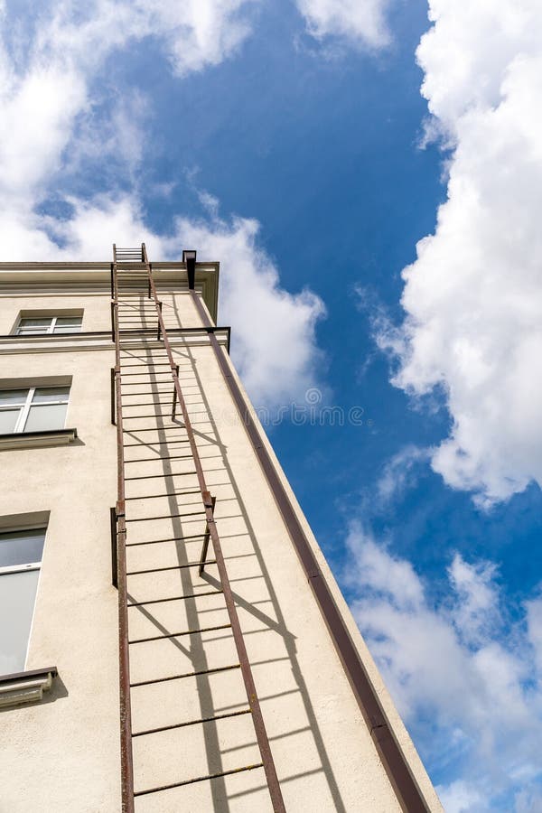 Metal Fire Ladder On The Building Wall Stock Photo - Image of ladder ...
