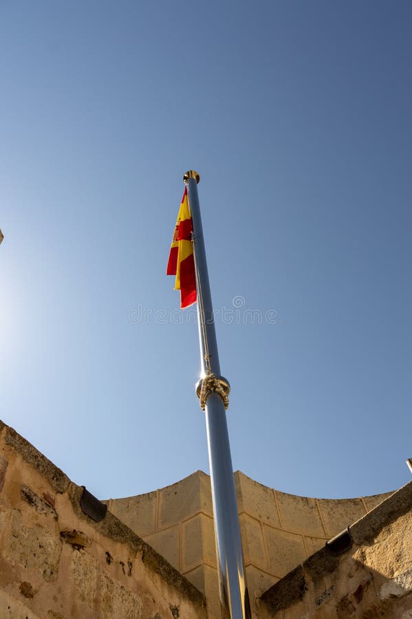 Metal Flagpole with the Flag of Spain on the Highest Part of a Castle ...
