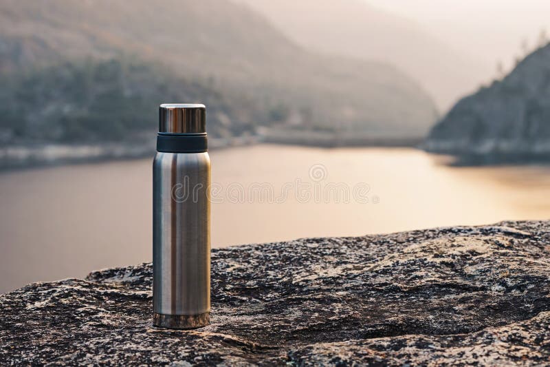 Metal Flask for Hot Drink Outdoors, Thermos Standing with a View Stock ...