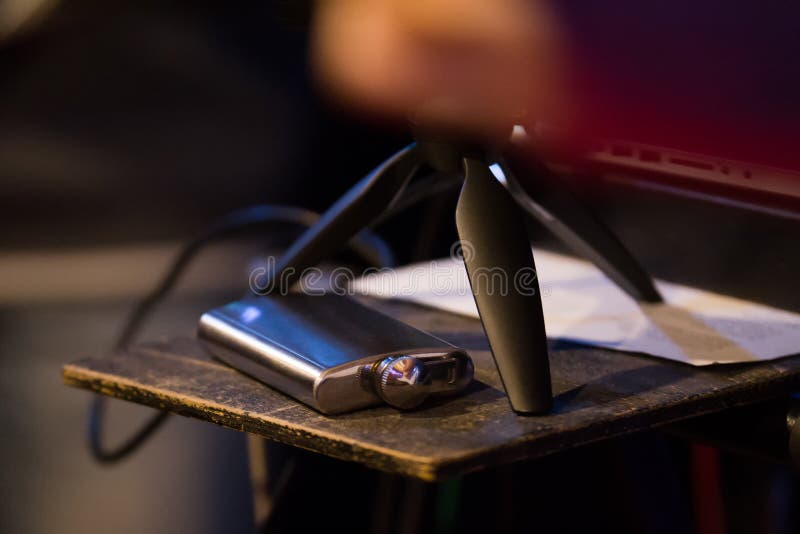 Metal flask on table stock image. Image of flask, cognac - 84576093