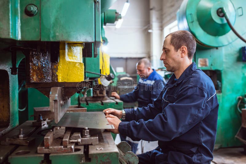Metal Formation by Hydraulic Press. Factory Worker at Work. Worker ...