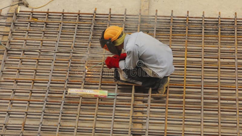 Metal Frame Construction. a Welder Welds a Metal Structure. Welding ...