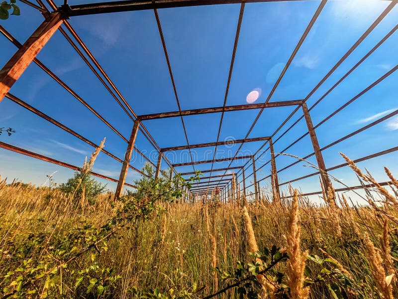 Metal Frame in the Field. a Deserted Place Overgrown with Weeds Stock ...
