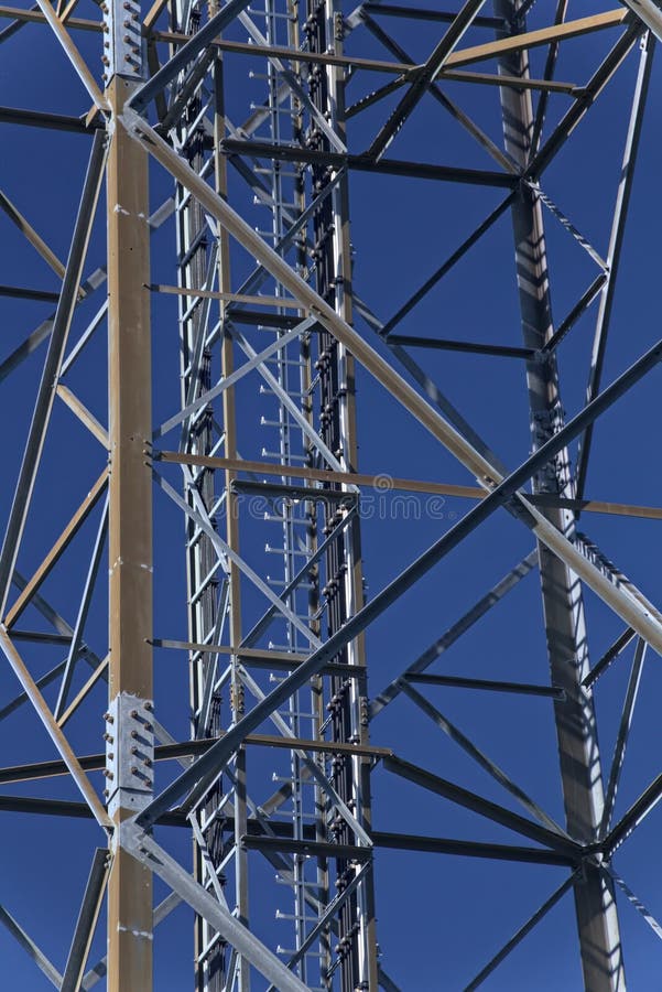Metal Frame of Telecommunications Tower in Front of a Dark Blue Sky ...