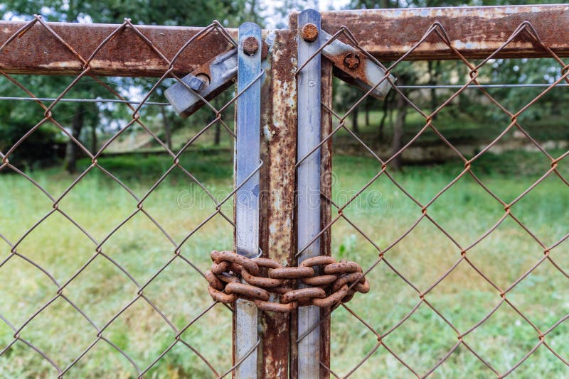 Metal Gate Closed with Rusty Chain Stock Image - Image of closed ...