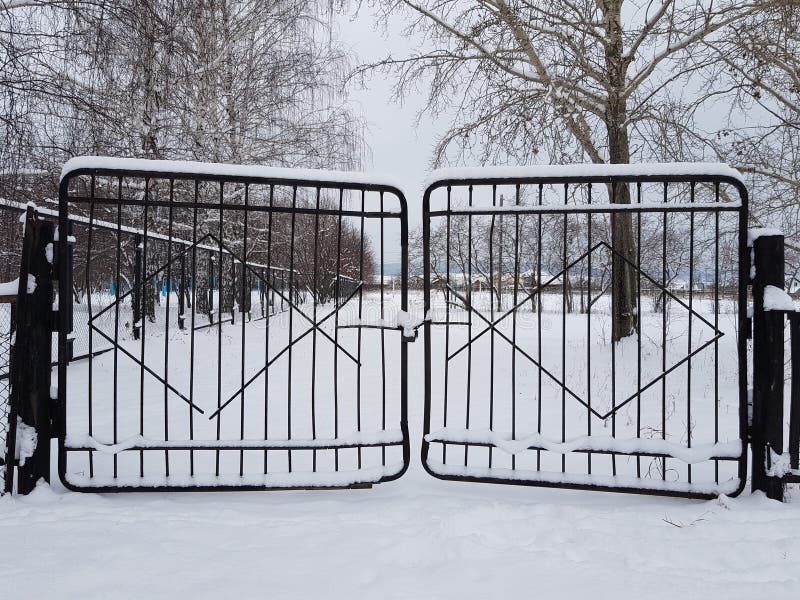 Metal Gate Covered with Snow Stock Photo - Image of door, ancient ...