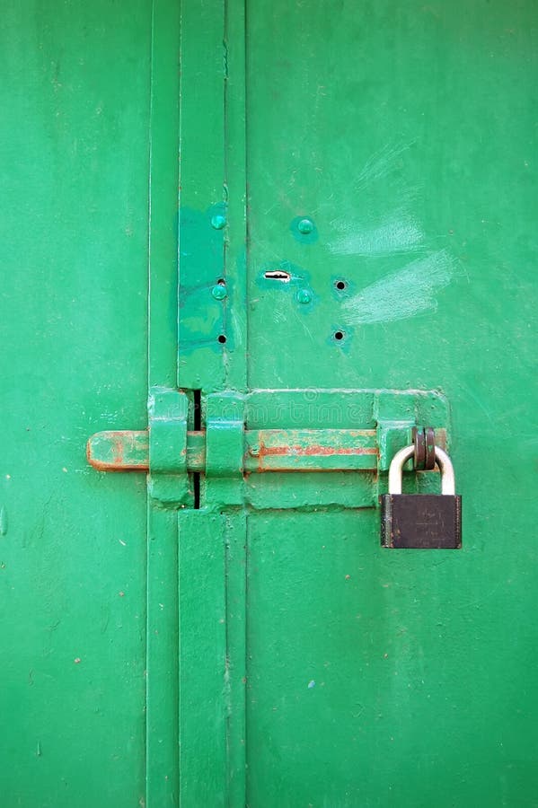 Metal Gate Lock on Green Gates. Stock Image - Image of aged, guard ...