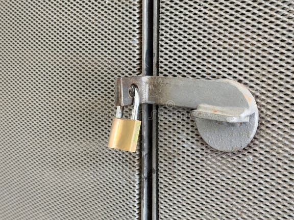Metal Gate with Padlock on Rusty Mesh Fence for Security and Protection ...