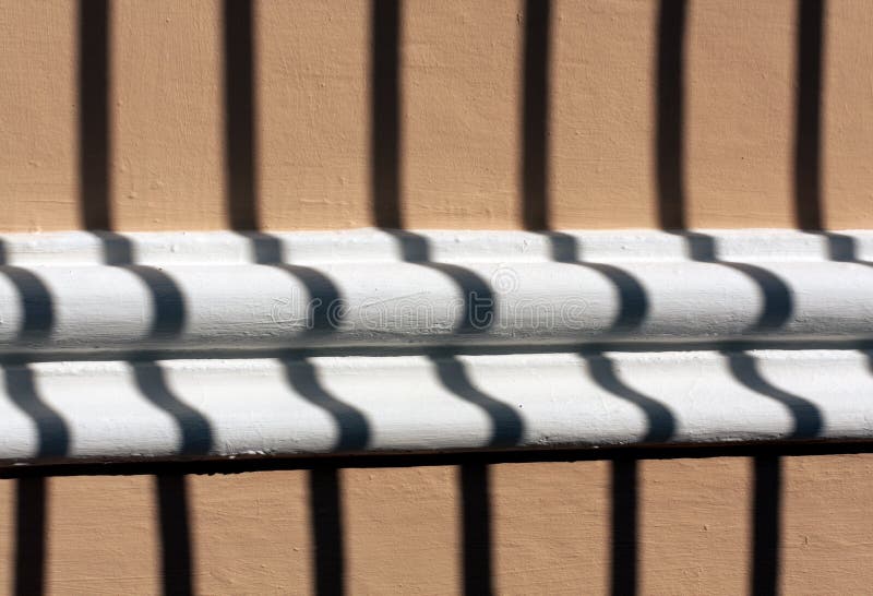 Metal Gate Shadow on Decorative Plaster Wall Texture. Stock Photo ...