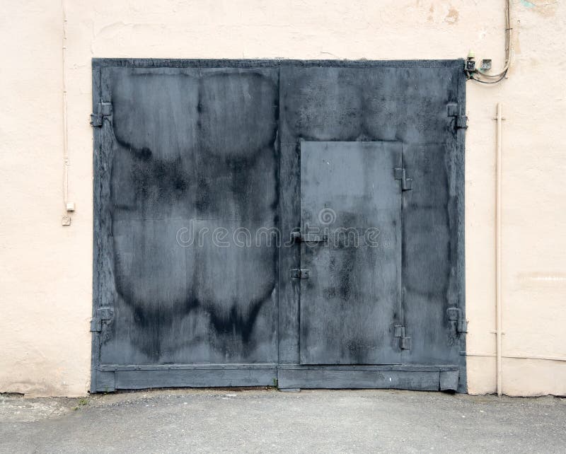 Metal Gate on the Wall of the Building Stock Photo - Image of ...