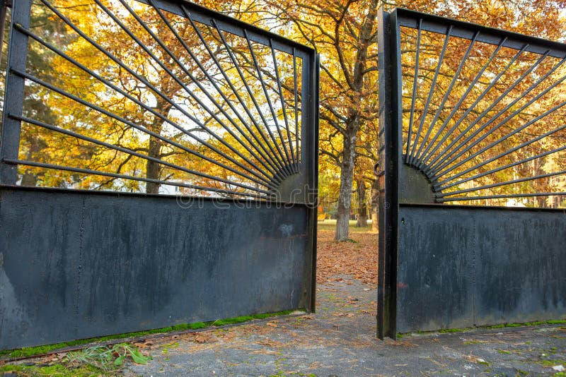 Metal gates in the park stock photo. Image of autumn - 260420148