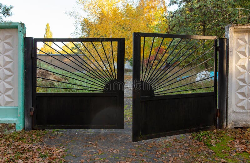 Metal gates in the park stock photo. Image of bright - 260706588