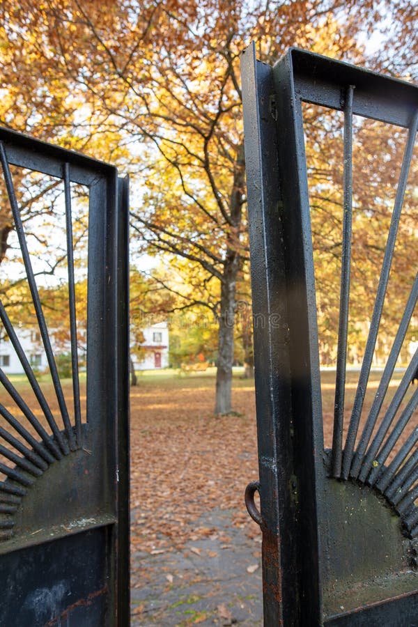 Metal gates in the park stock image. Image of yellow - 263714371