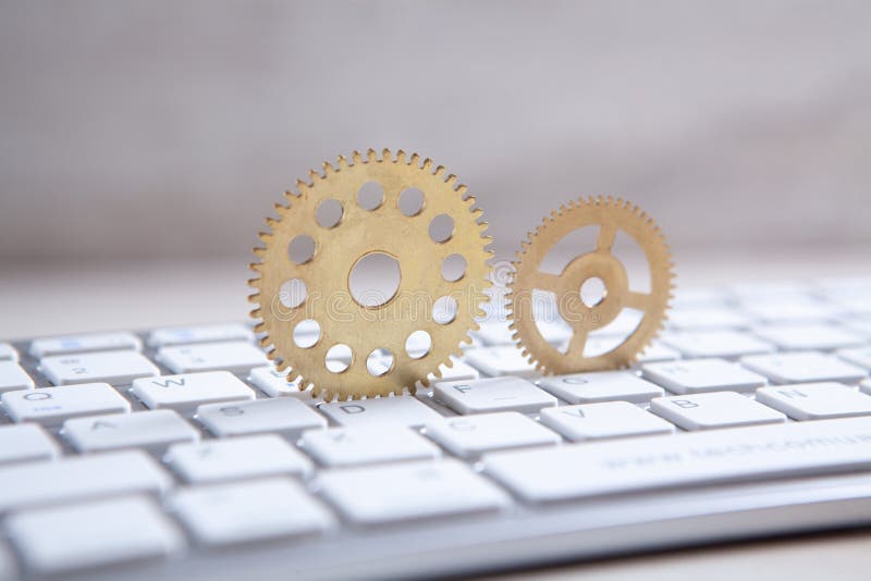 Metal Gear Wheels on a Computer Keyboard Stock Image - Image of ...