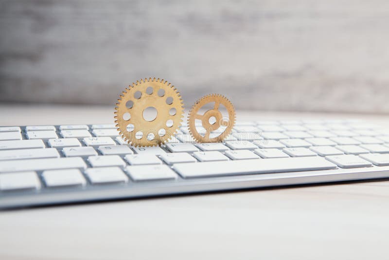 Metal Gear Wheels on a Computer Keyboard Stock Image - Image of setup ...
