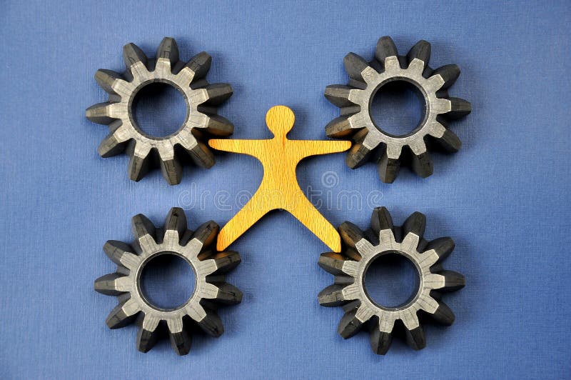 Metal Gears and a Figure of a Man Made of Wood Stock Image - Image of ...