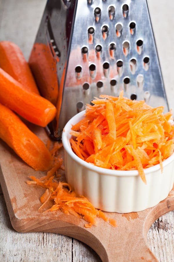 Metal grater and carrot stock image. Image of orange - 39113807