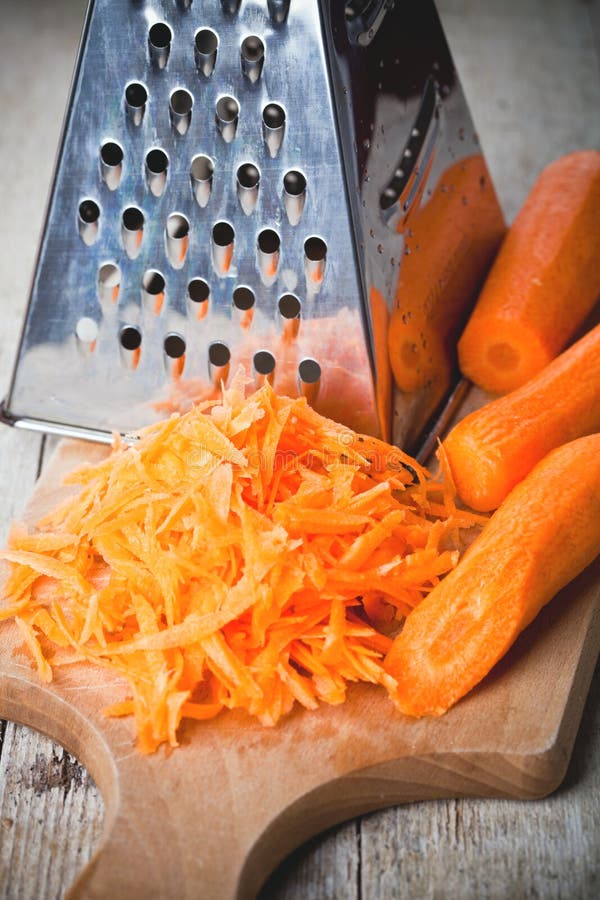 Metal grater and carrot stock photo. Image of closeup - 40734846