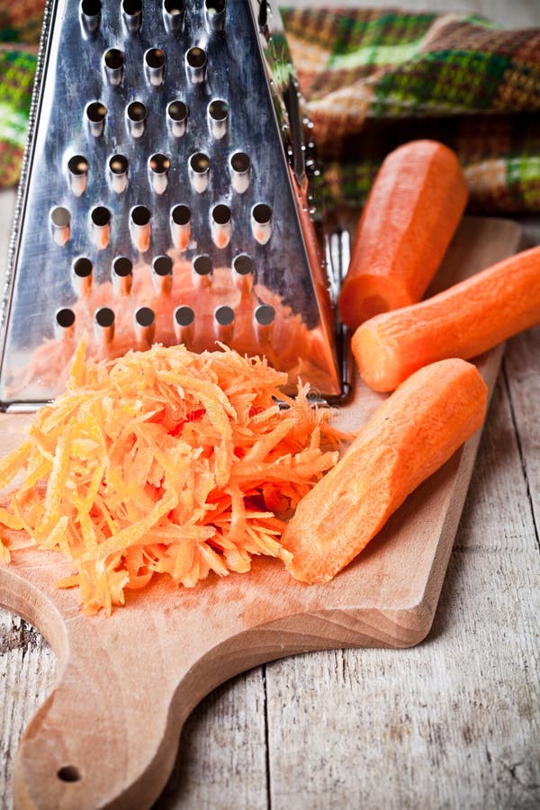 Metal grater and carrots stock image. Image of appliance - 40566195