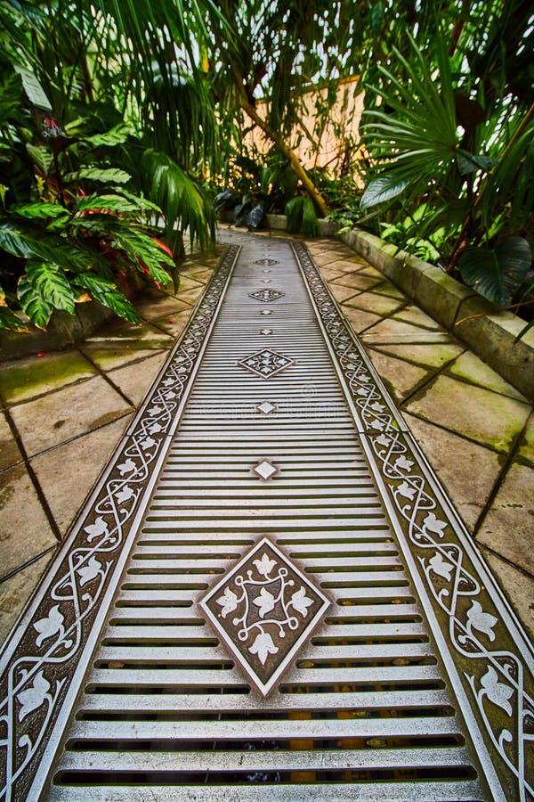 Metal Grates and Fancy Decor on Sidewalk Path through Conservatory of ...