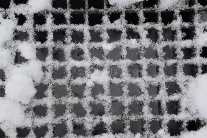 Metal grid covered by snow stock photo. Image of metal - 176812876