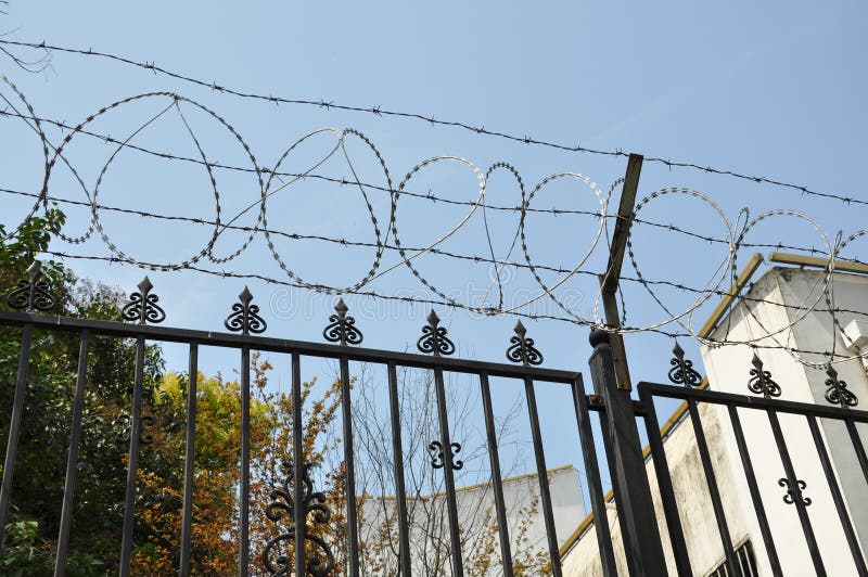 Metal Grid Fence with Barbed Wire Stock Image - Image of iron, privacy ...