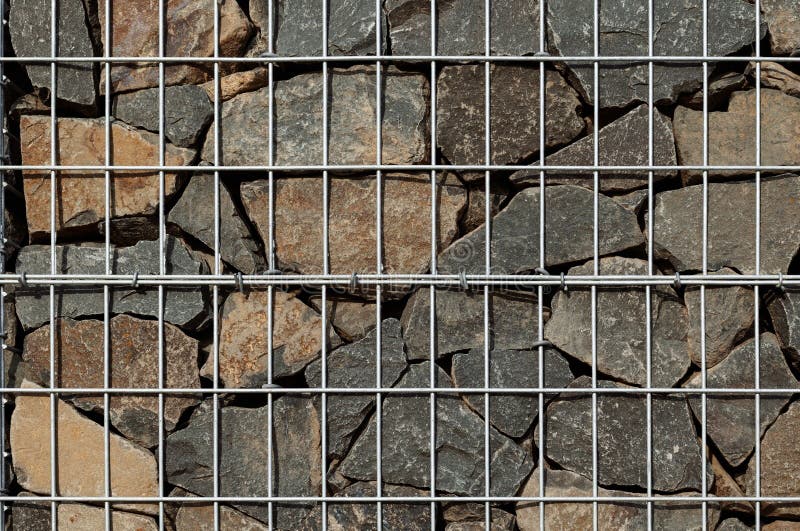 Metal Grid with Natural Stones in Gabion Stock Image - Image of filled ...