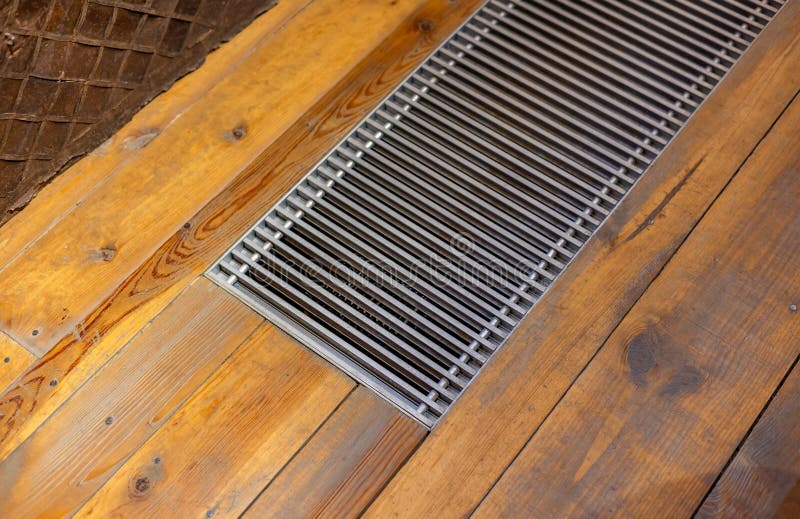 Metal Grill of a Modern Convector Heating in the Floor Next To the ...
