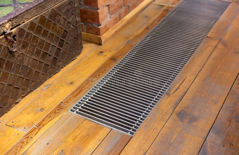 Metal Grill of a Modern Convector Heating in the Floor Next To the ...