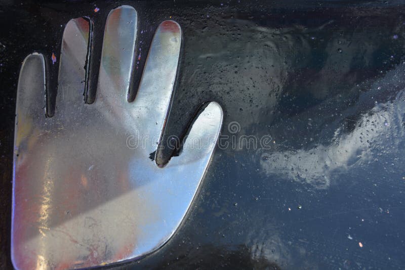 Metal Hand Shape on a Black Surface Stock Image - Image of hand, metal ...
