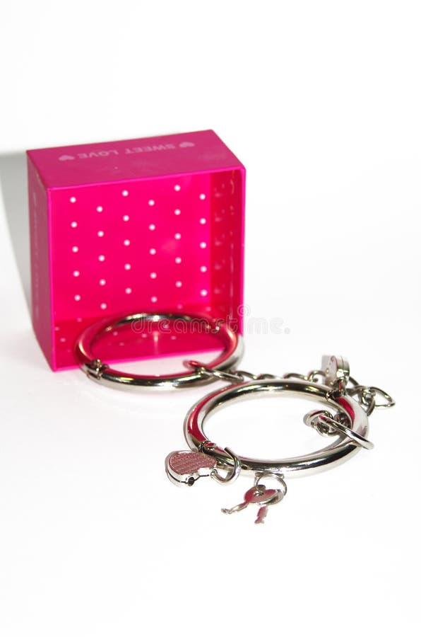 Metal Handcuffs Isolated On The White Background And Red Ribbon Stock ...