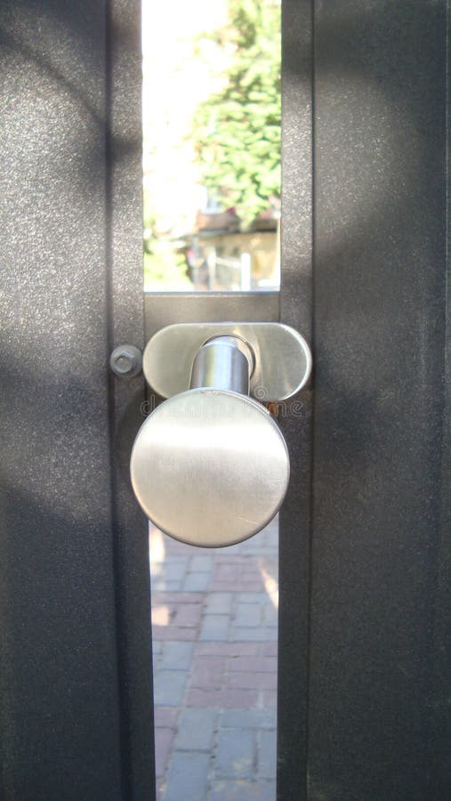 Metal handle on the gate stock image. Image of handle - 224823553