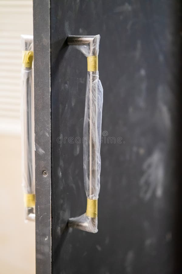 Metal Handles Covered with Plastic at the Office Entrance in a ...