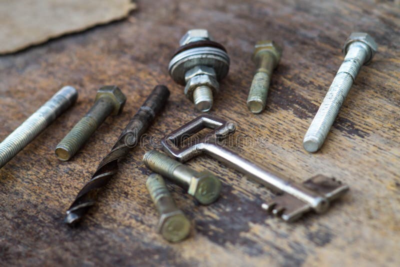 Metal Hardware with Carvings Figures on a Wooden Background Stock Photo ...