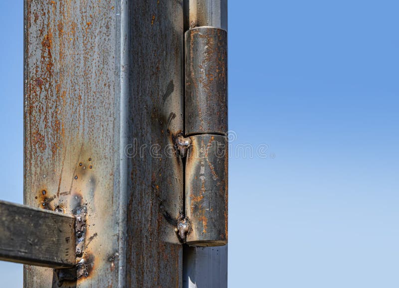 Metal hinge on the gate. stock photo. Image of building - 253984242