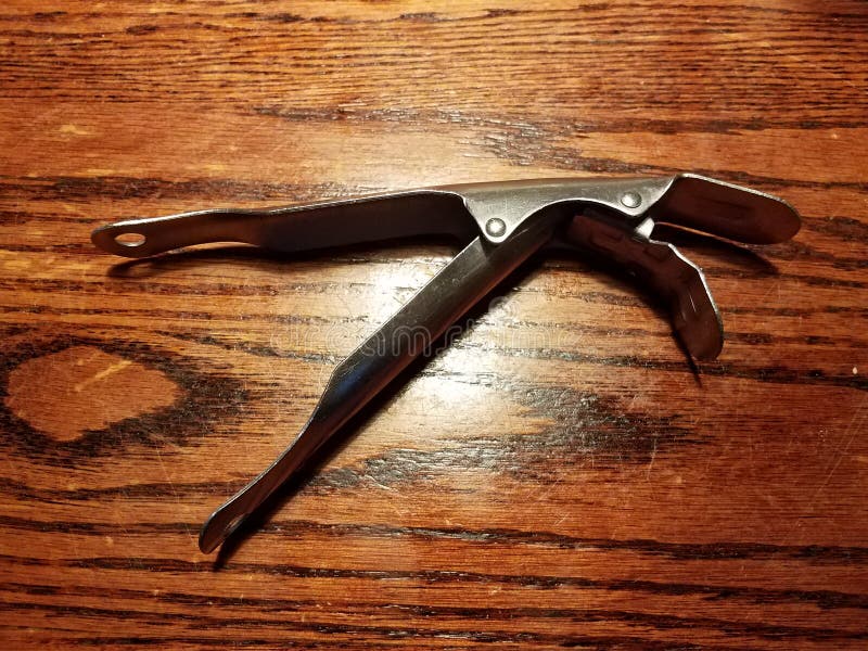 Metal Hot Pan Holder Tool on Wood Table Stock Photo - Image of table ...