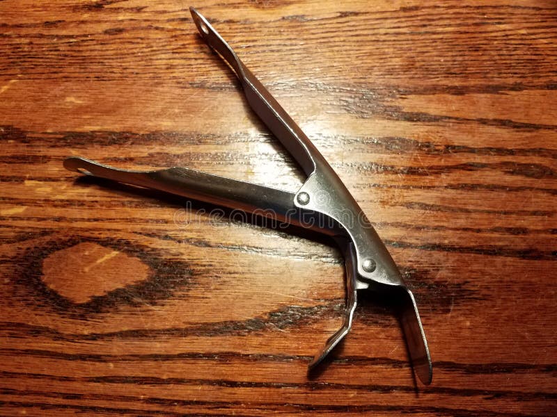 Metal Hot Pan Holder Tool on Wood Table Stock Image - Image of brown ...