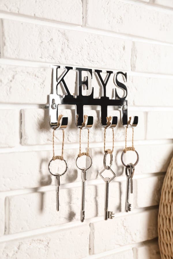 Metal Key Holder on White Brick Wall Stock Photo - Image of access ...