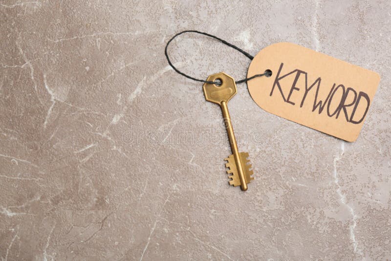 Metal Key and Tag with Word KEYWORD on Grey Table, Top View. Space for ...