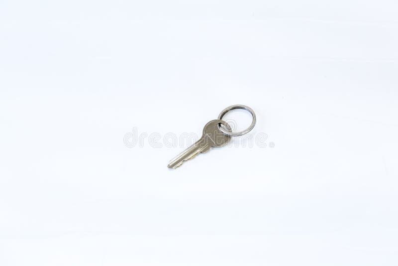 Metal key on white ground stock photo. Image of keys - 154985028