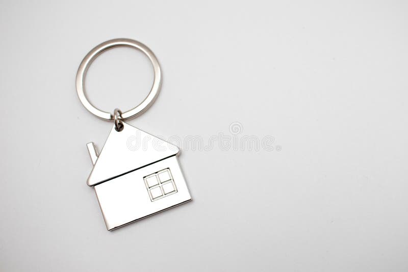 Keychain in the Shape of a House with a Key in the Hands of a Person ...