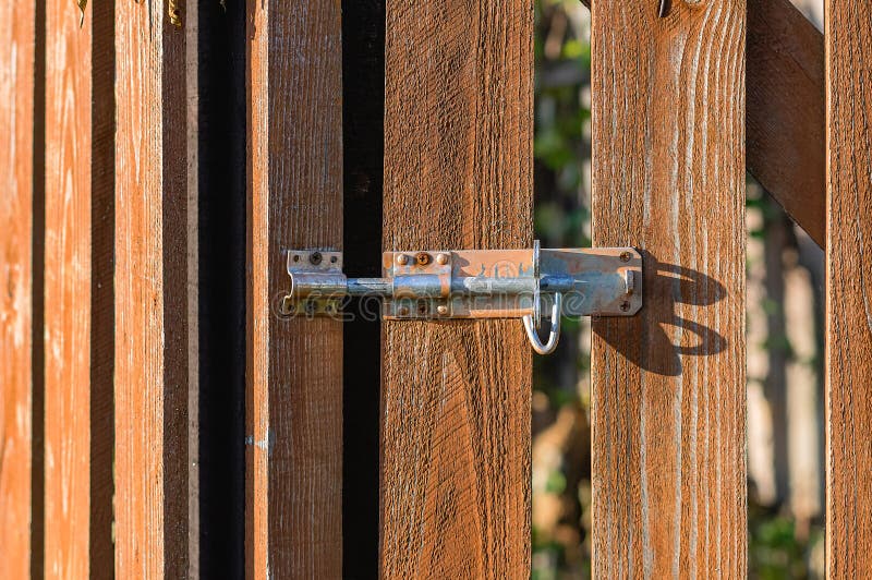 Metal Latch on a Wooden Gate in Sunlight. Close Up. Stock Image - Image ...