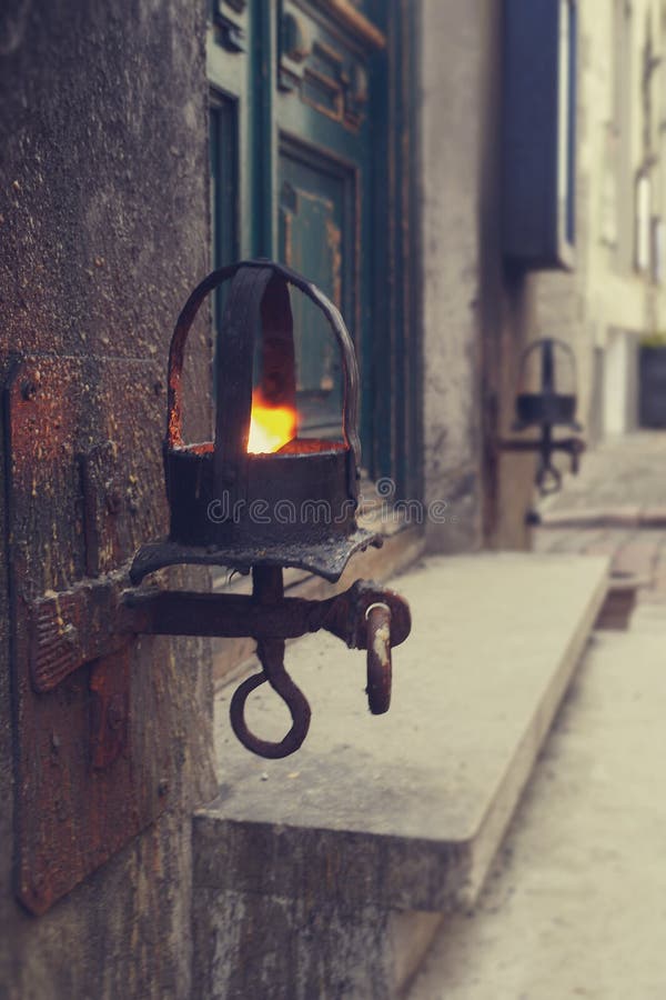 A Metal Lit Lantern with Burning Fire Light Placed by Two Sides Around ...